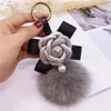 Butterfly Hills Camellia Bone Keychain with Fox Hair Ball and LED ...